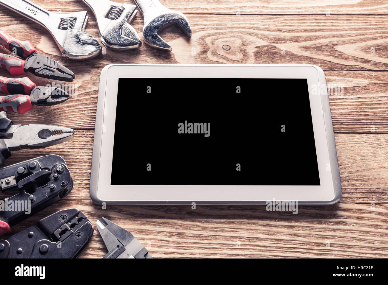 Variety of tools of builder and tablet pc on wooden texture table Stock ...