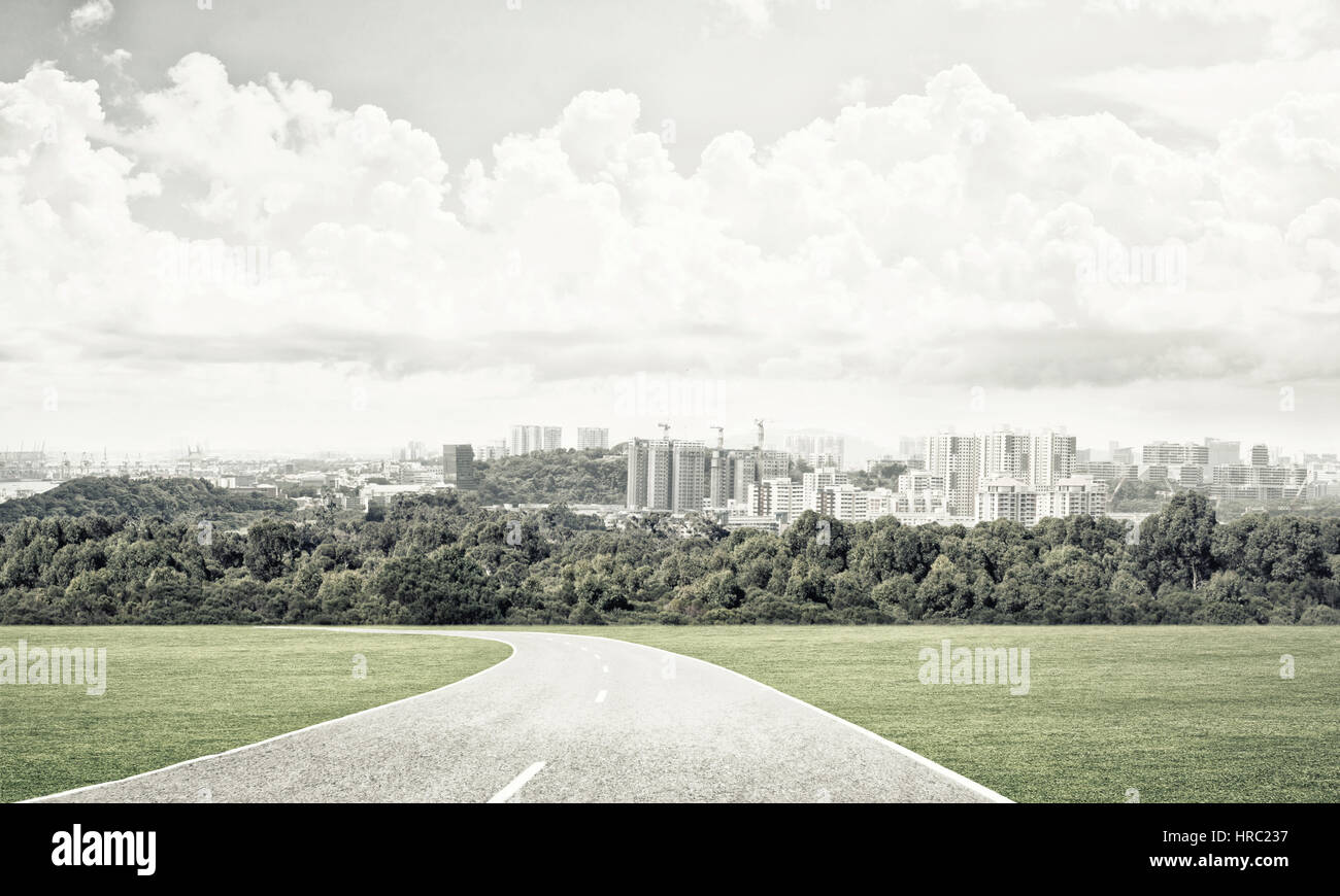 Natural landscape of countryside road and modern city Stock Photo - Alamy