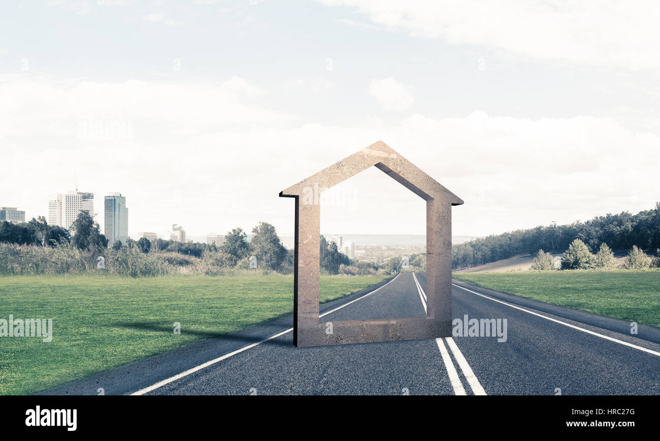 House stone figure as symbol of real estate outdoors against natural ...