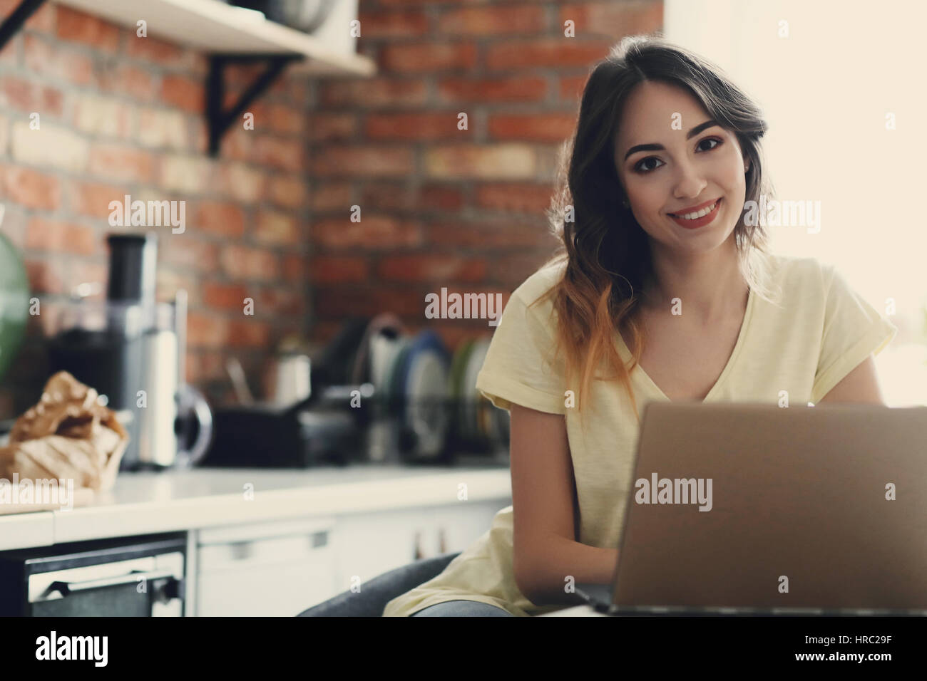 Lovely girl in the kitchen Stock Photo - Alamy