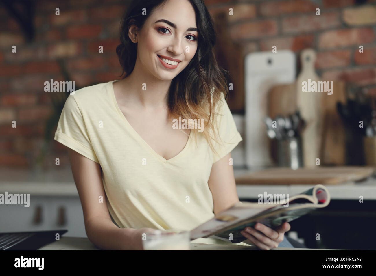 Lovely girl in the kitchen Stock Photo - Alamy