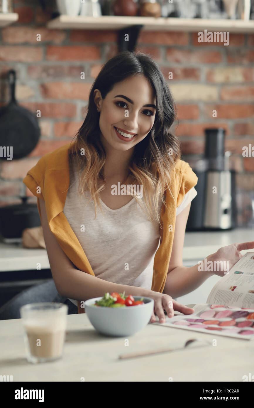 Lovely girl in the kitchen Stock Photo - Alamy