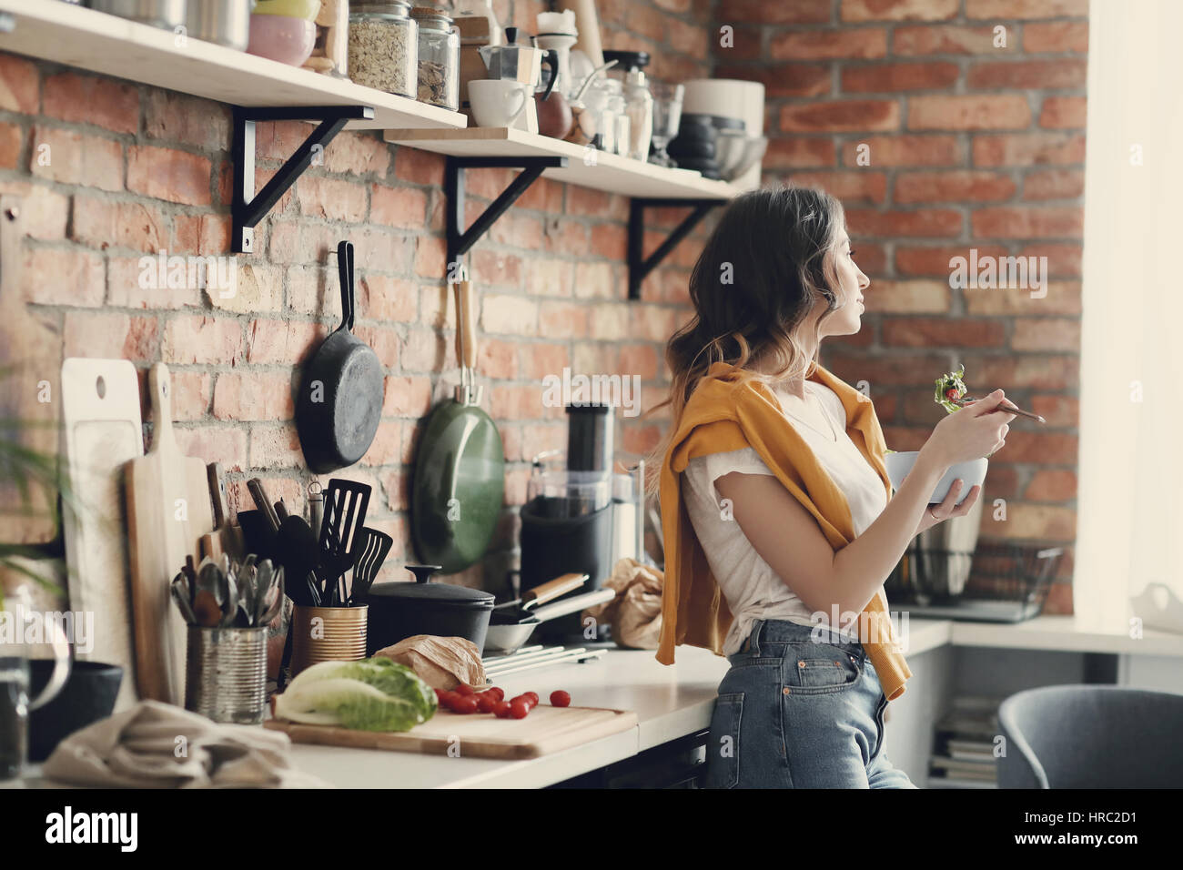 Lovely girl in the kitchen Stock Photo - Alamy
