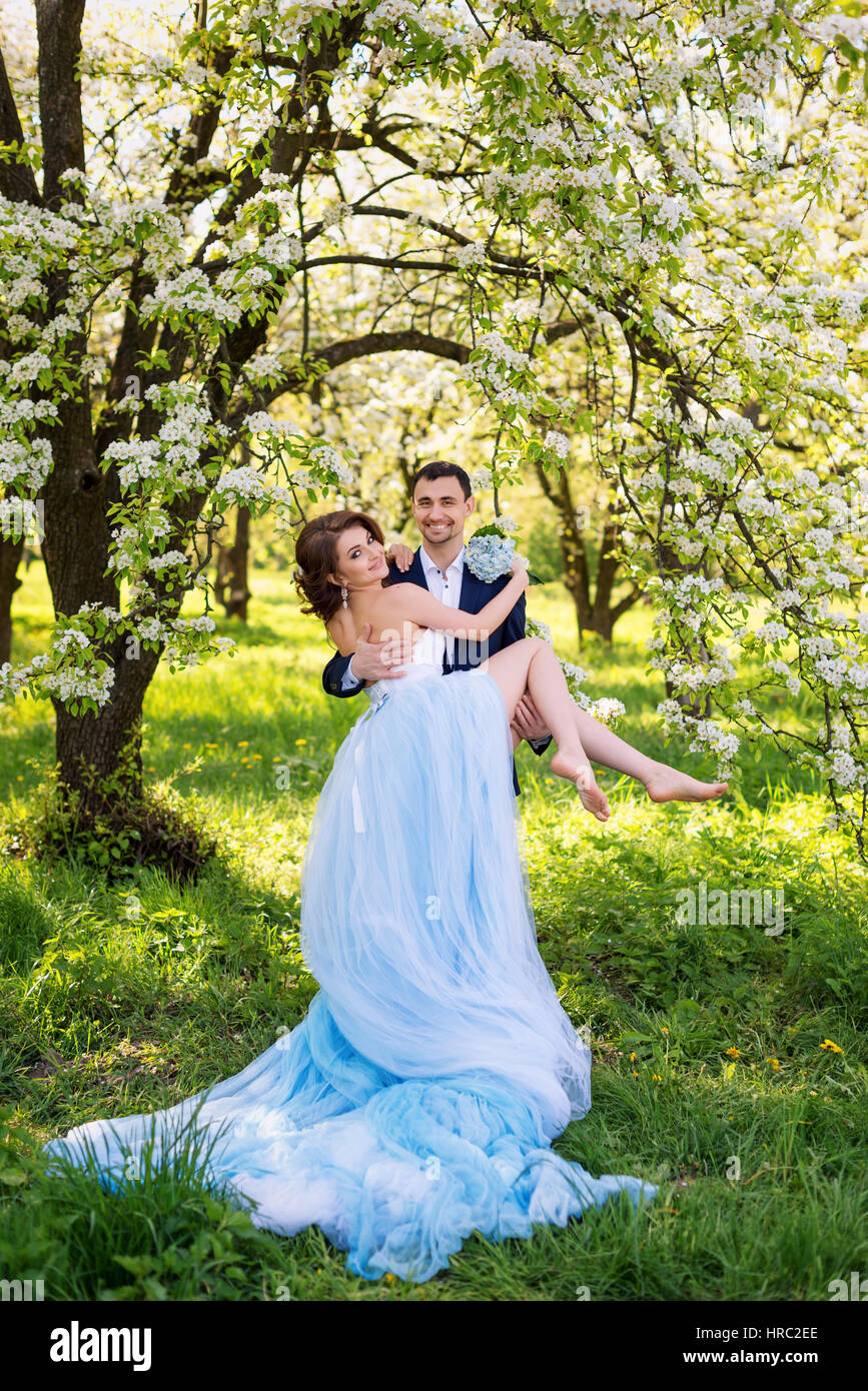 Romantic young man lifting girlfriend High Resolution Stock Photography ...