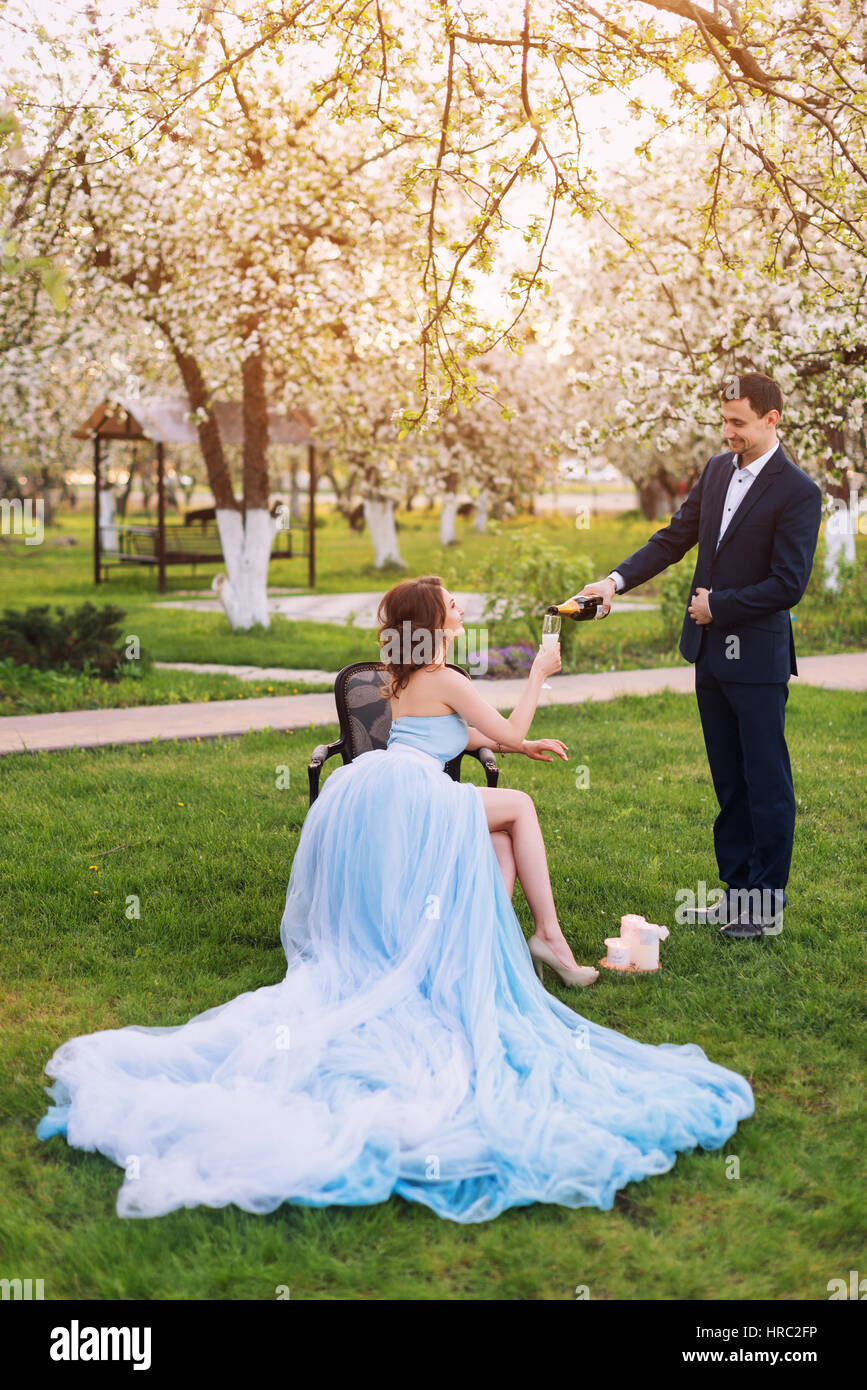 Couple drinking champagne outdoor. Young man making a proposal of ...