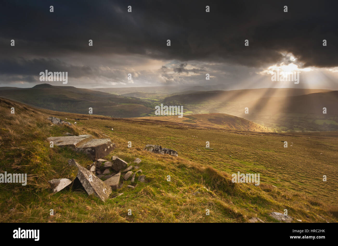 The sun sends shafts of light on Pen Cerrig Calch, Black Mountains ...