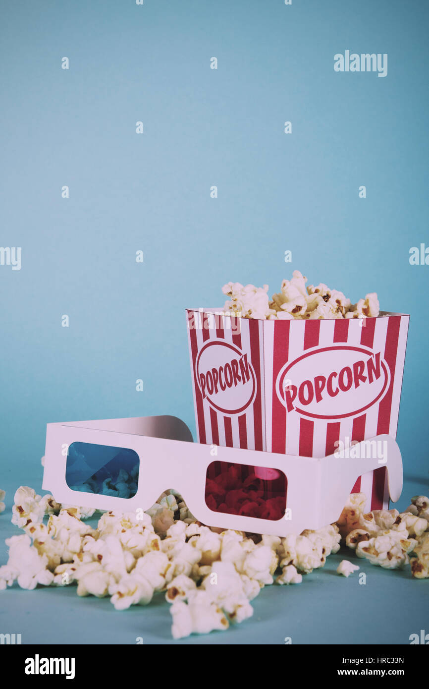 Bucket of popcorn against a blue background Vintage Retro Filter Stock ...