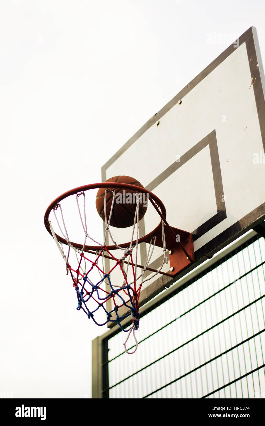 Basketball hoop outside in a school play area Stock Photo - Alamy