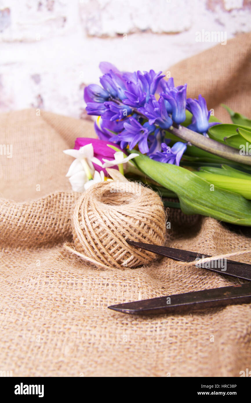 Spring cut flower arrangement against a rustic background Stock Photo ...
