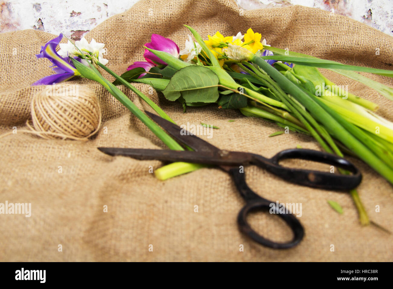 Spring cut flower arrangement against a rustic background Stock Photo ...