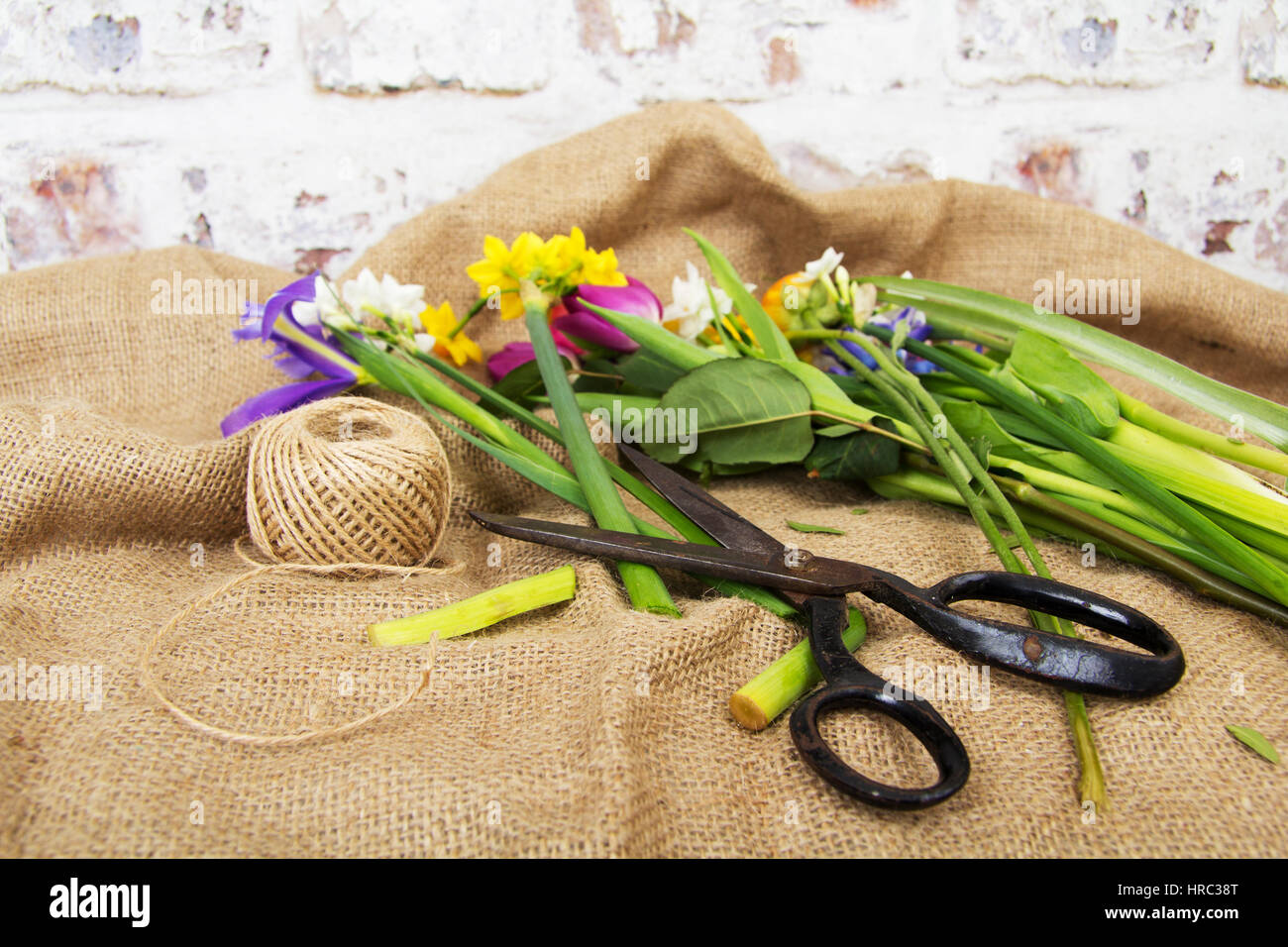 Spring cut flower arrangement against a rustic background Stock Photo ...