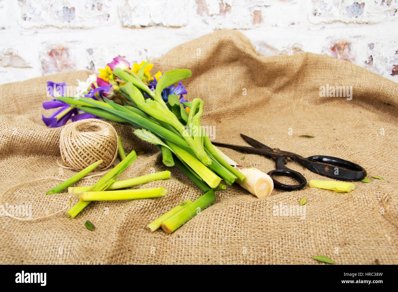 Spring cut flower arrangement against a rustic background Stock Photo ...