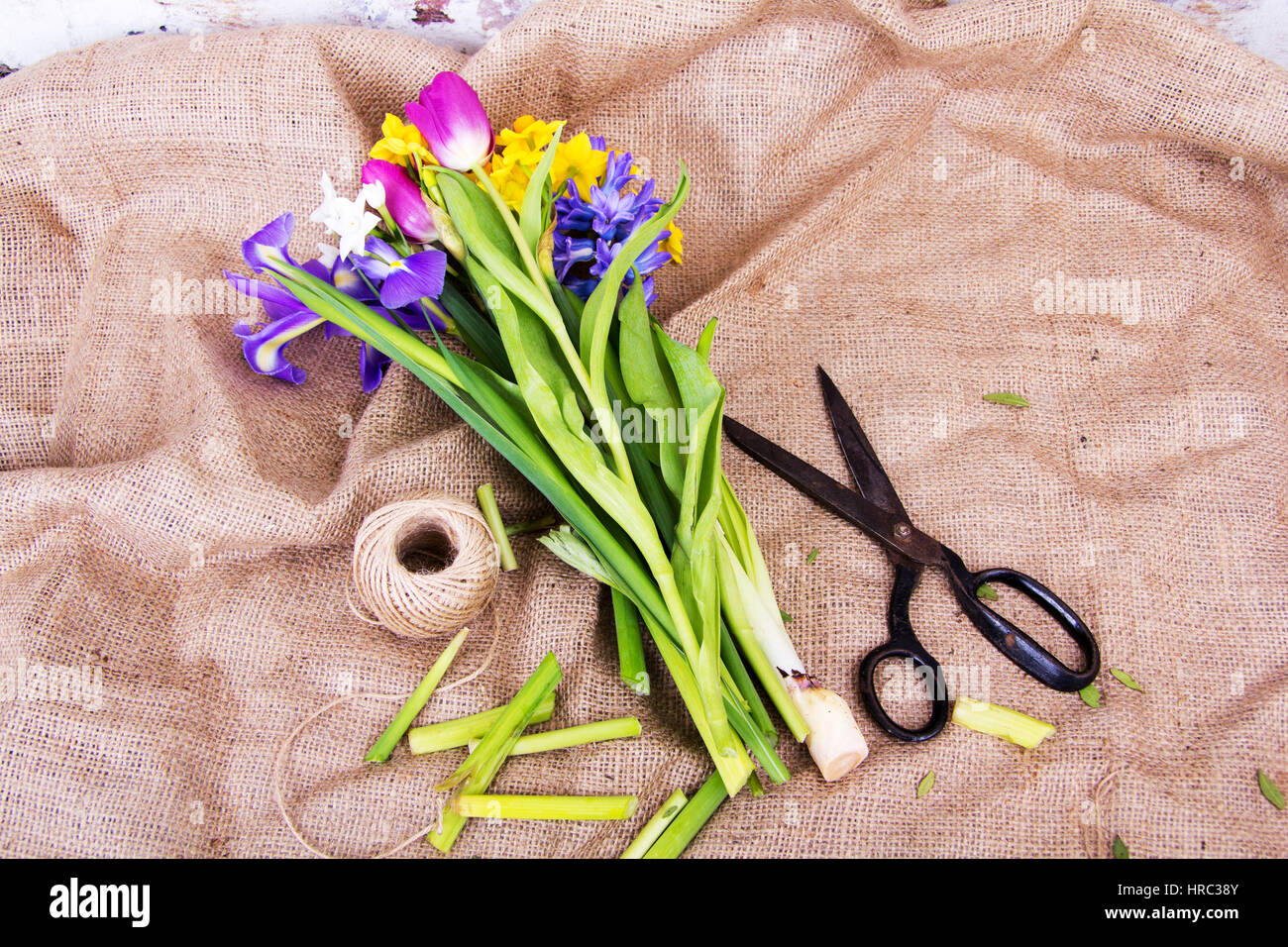 Spring cut flower arrangement against a rustic background Stock Photo ...