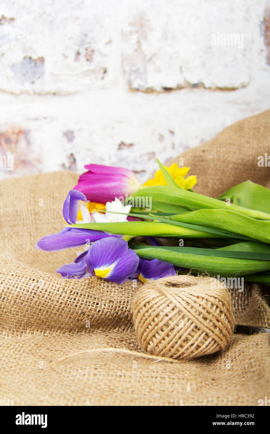 Spring cut flower arrangement against a rustic background Stock Photo ...