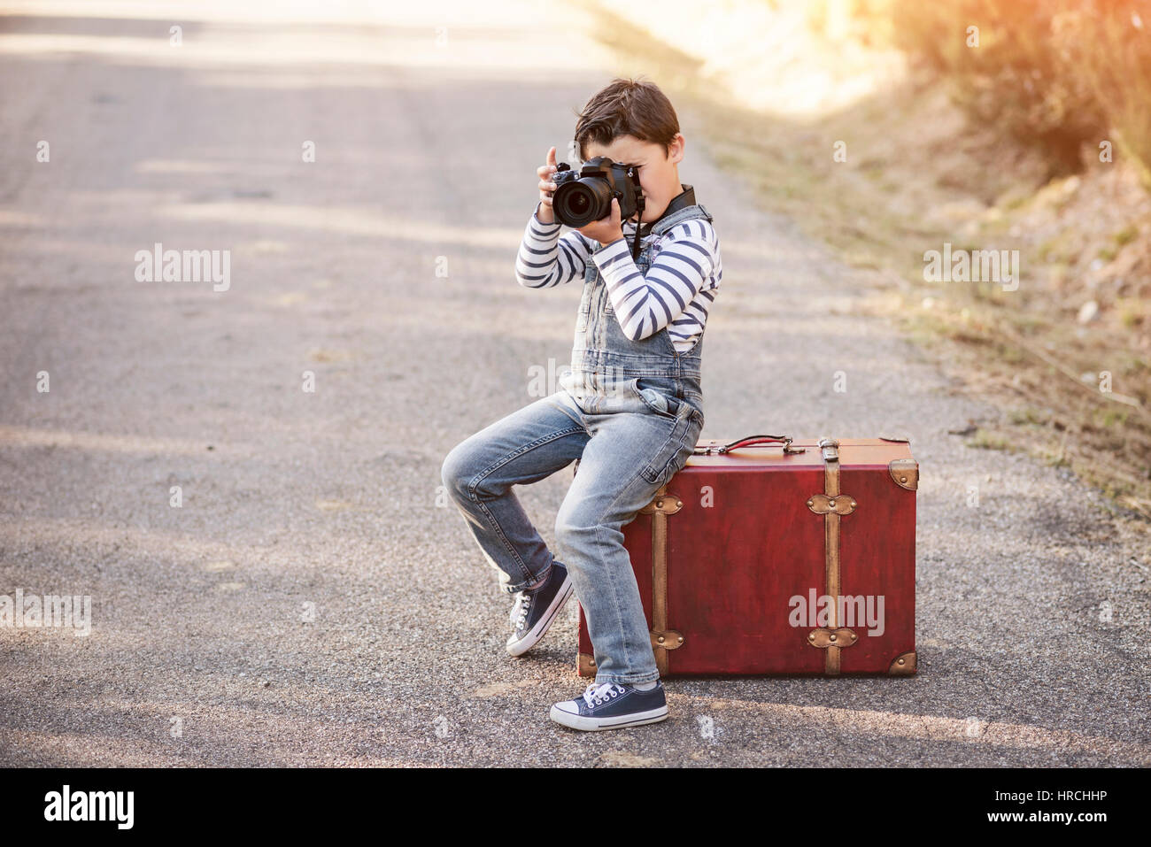 Boy with camera Stock Photo - Alamy