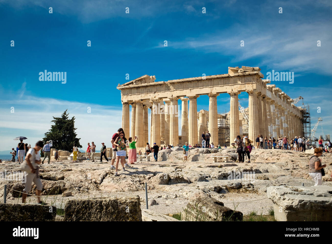 Crowd of tourists sightseeing at the Acropolis, Athens viewing the ...