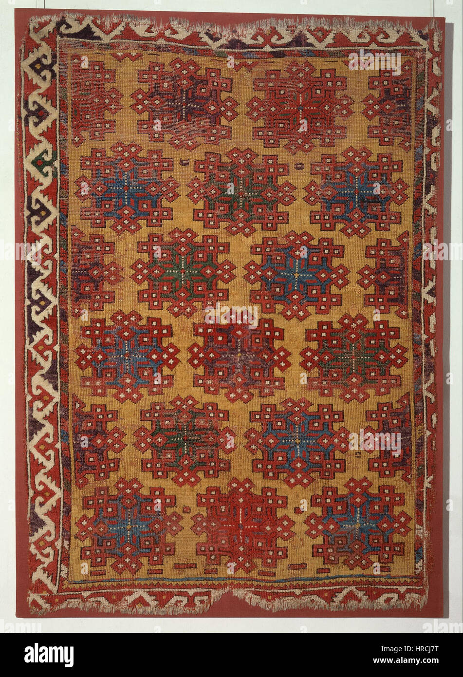 'Rug with Interlaced Rosettes' is a decorative piece featuring ...