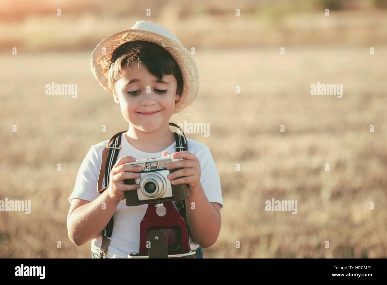 Boy with camera Stock Photo - Alamy