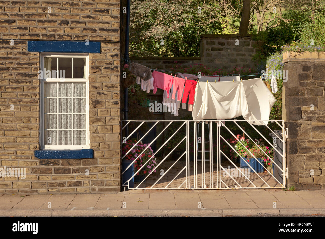 Clean wash drying next to a house in Yorkshire Stock Photo - Alamy