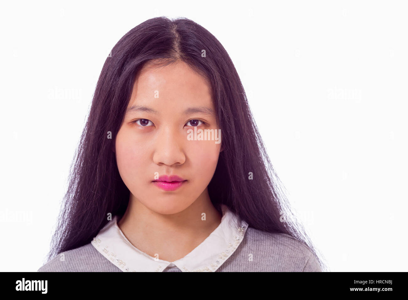 Portrait Of Chinese Teenage Girl Looking At Camera Serious Expression 2025