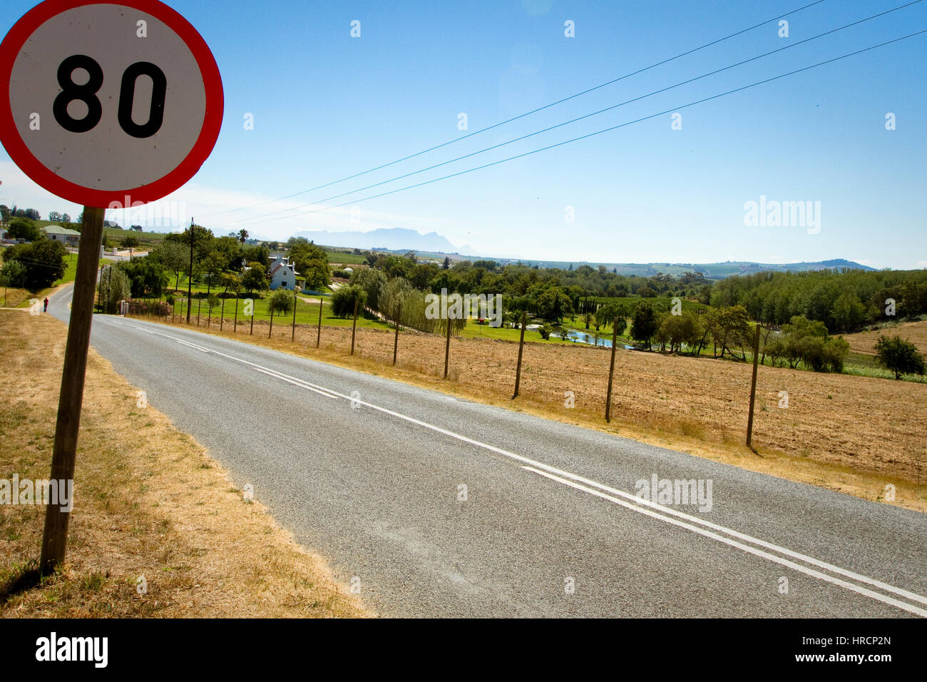 Typical South African rural road with an 80 kilometer per hour speed ...