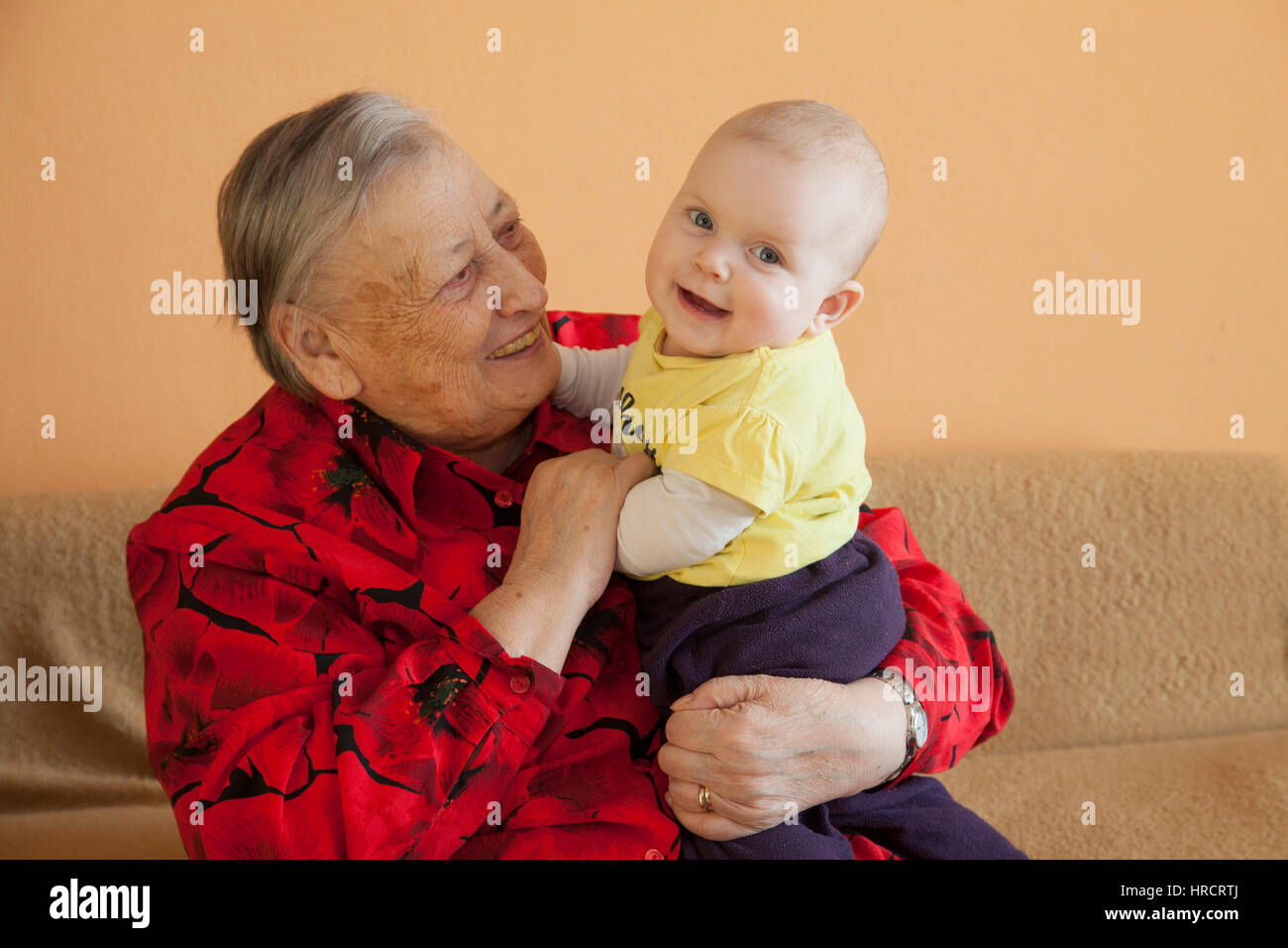 Granny with baby in arms hi-res stock photography and images - Alamy