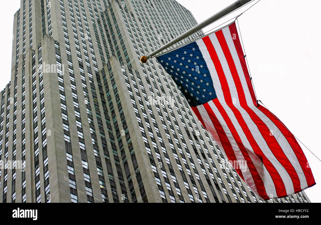 The US Flag flying near Rockerfeller Plaza Stock Photo - Alamy