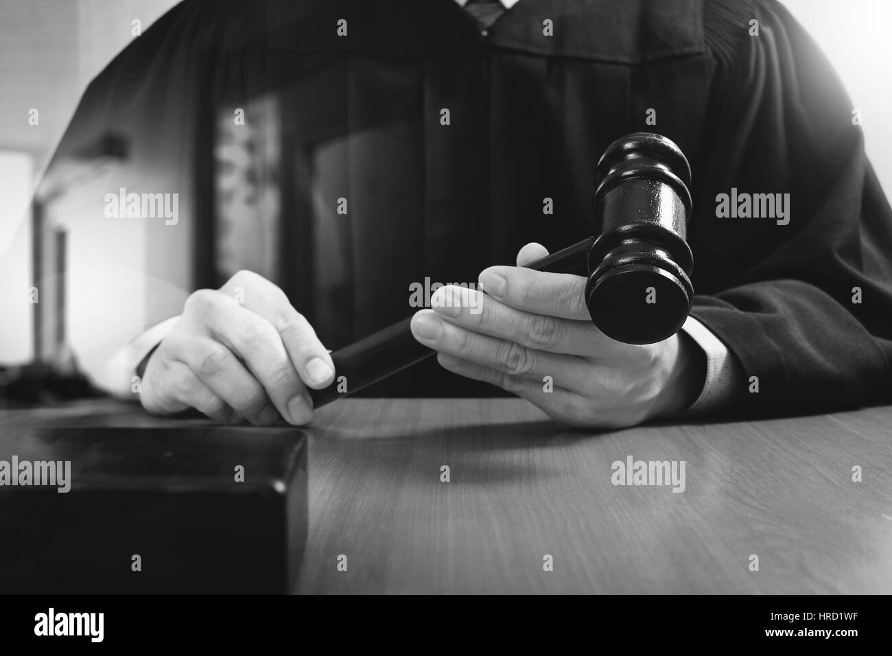 justice and law concept.Male judge in a courtroom striking the gavel ...