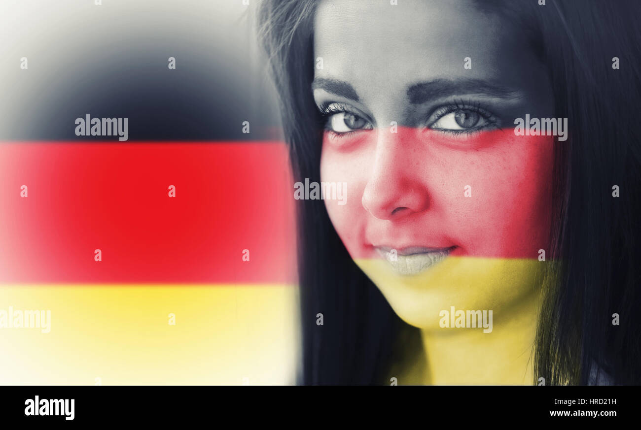 The flag of Germany on the face of a smiling woman. / Color effects and ...