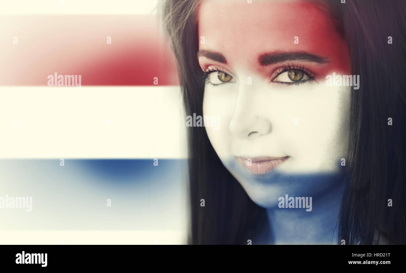The flag of Netherlands on the face of a smiling woman. / Color effects ...