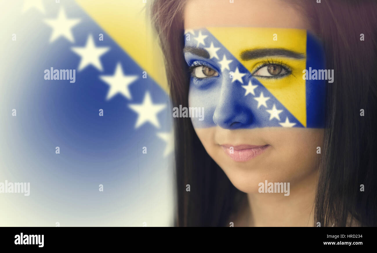 The flag of Bosnia and Herzegovina on the face of a smiling woman ...