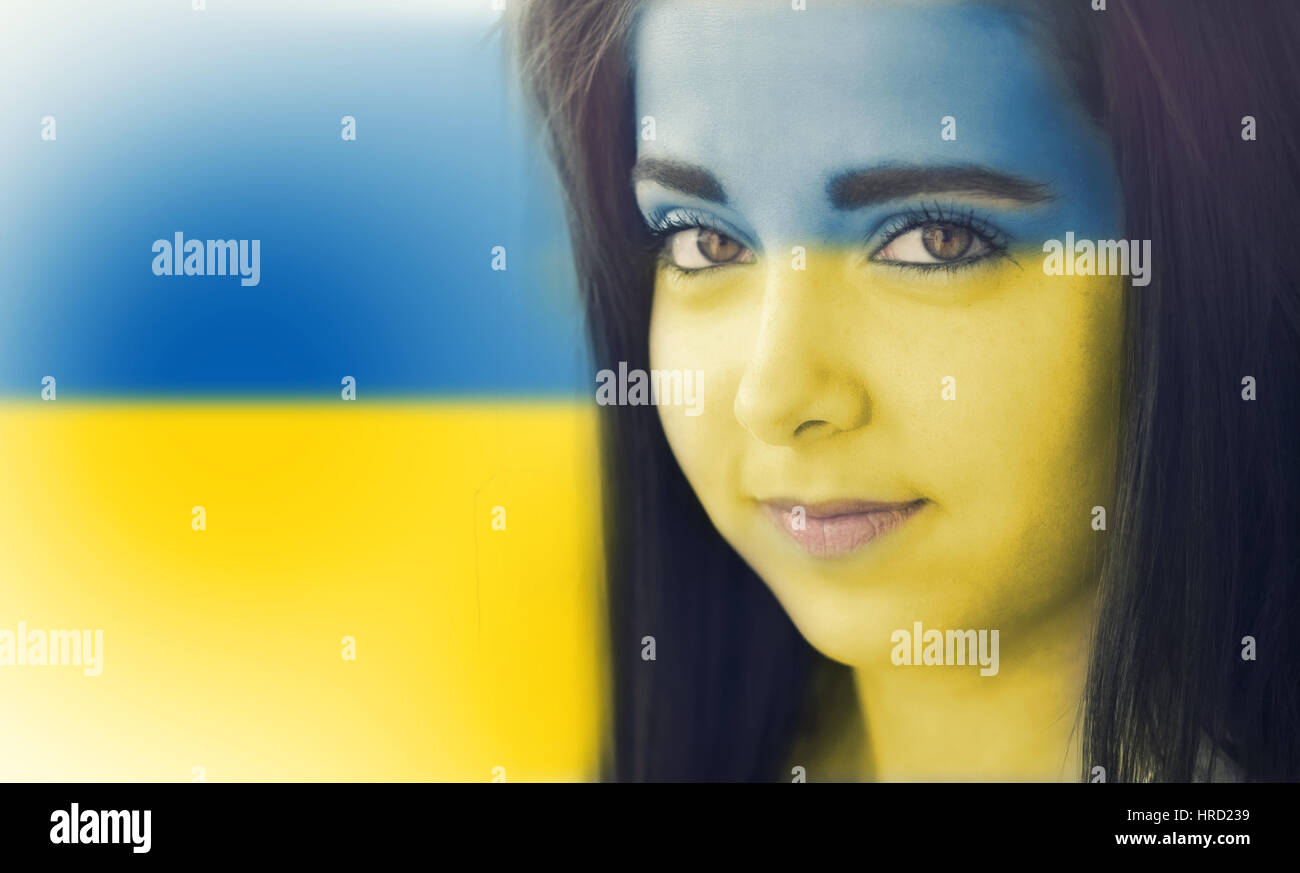 The flag of Ukraine on the face of a smiling woman. / Color effects and ...