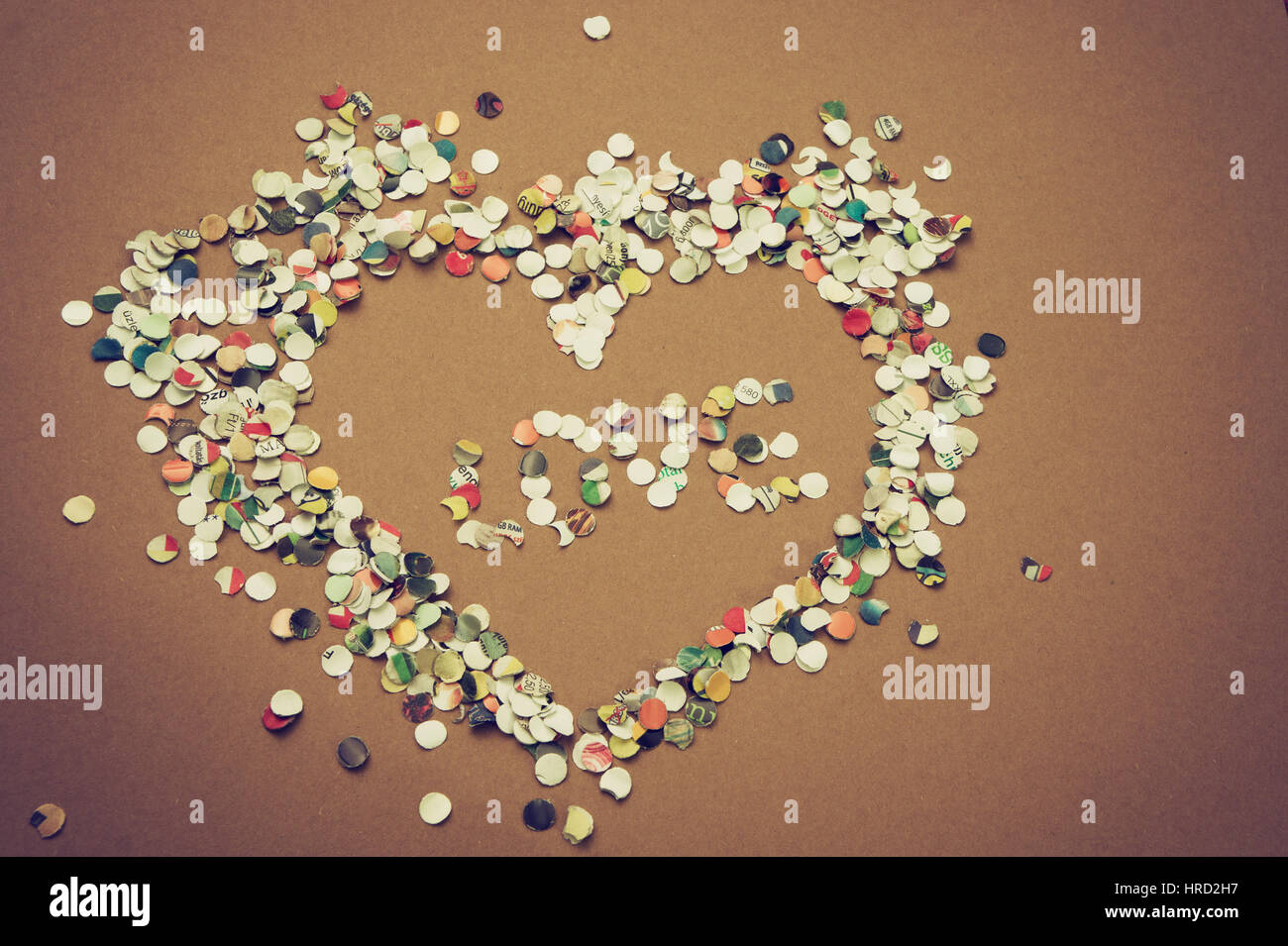 Confetti heart with subtitle on a golden background / Valentine's ...