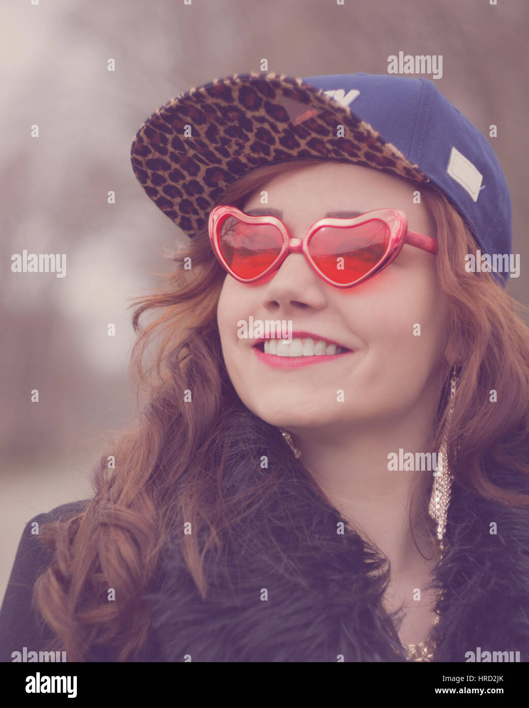 Young Girl Smiles In Her Red Heart Sunglasses Beuty Fashion Portrait