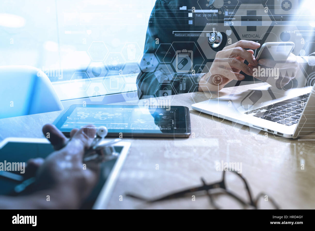 medical doctor hand working with smart phone,digital tablet computer ...