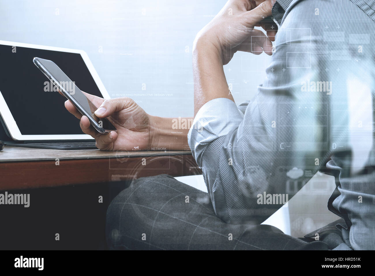 success businessman hand using smart phone,digital tablet docking smart keyboard on wood desk ...