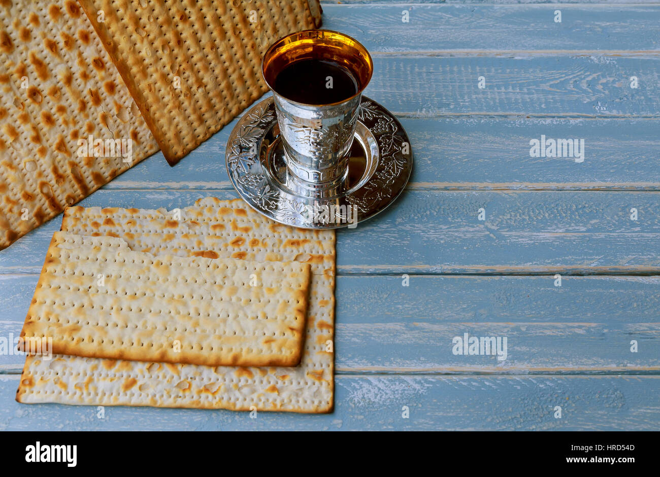 passover matzo with kiddush cup of wine wooden table Stock Photo - Alamy