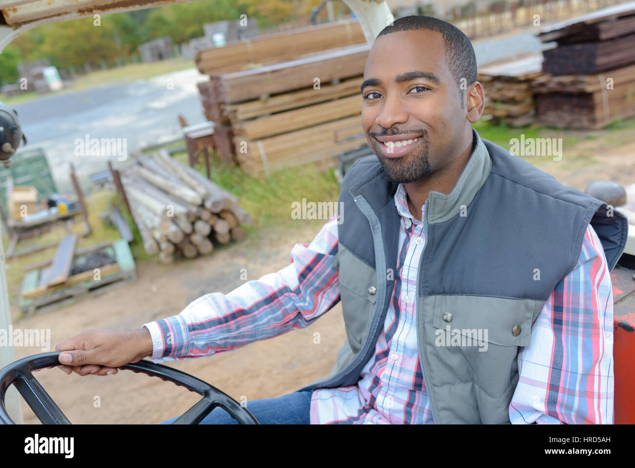 worker driving a vehicle Stock Photo - Alamy