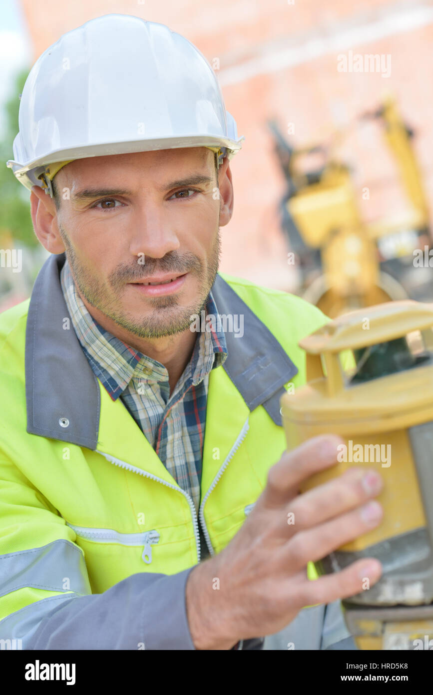 Construction worker young measure hi-res stock photography and images ...
