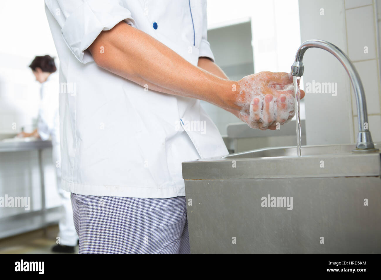 Chef washing hands Stock Photo - Alamy