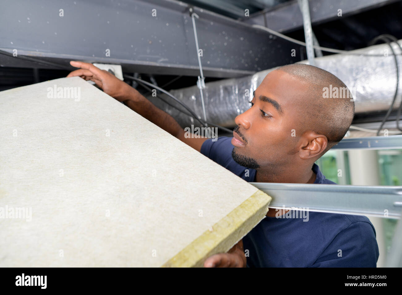 worker installing isolation plates Stock Photo - Alamy