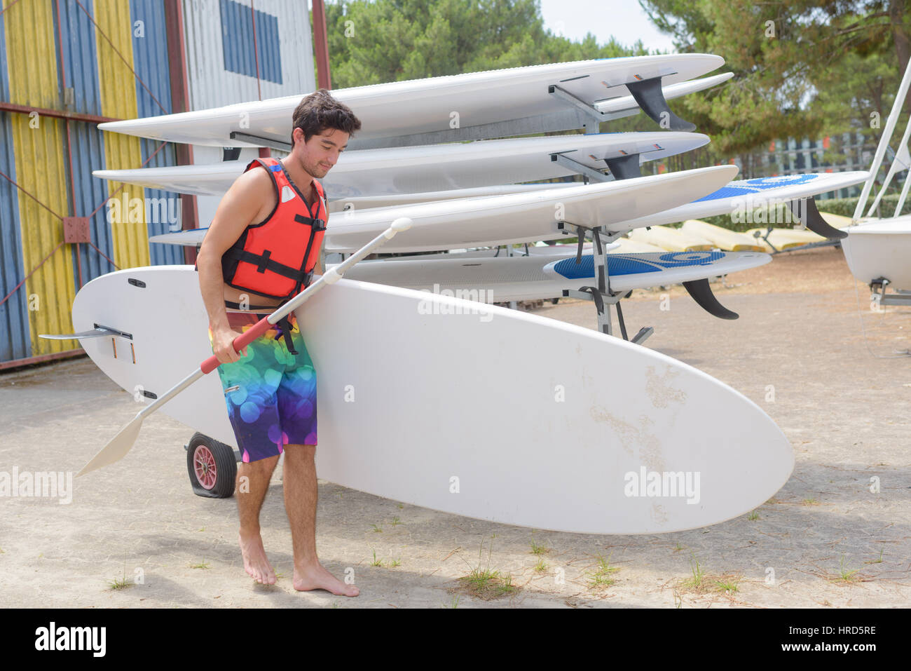 Man carry surf board hi-res stock photography and images - Alamy