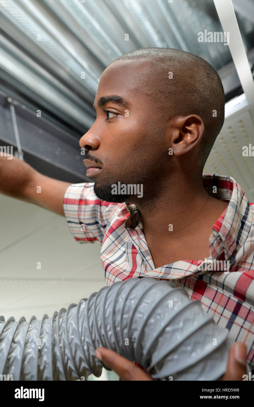 Man holding hose pipe hi-res stock photography and images - Alamy