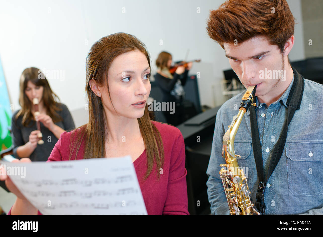 Learning to play the sax Stock Photo - Alamy