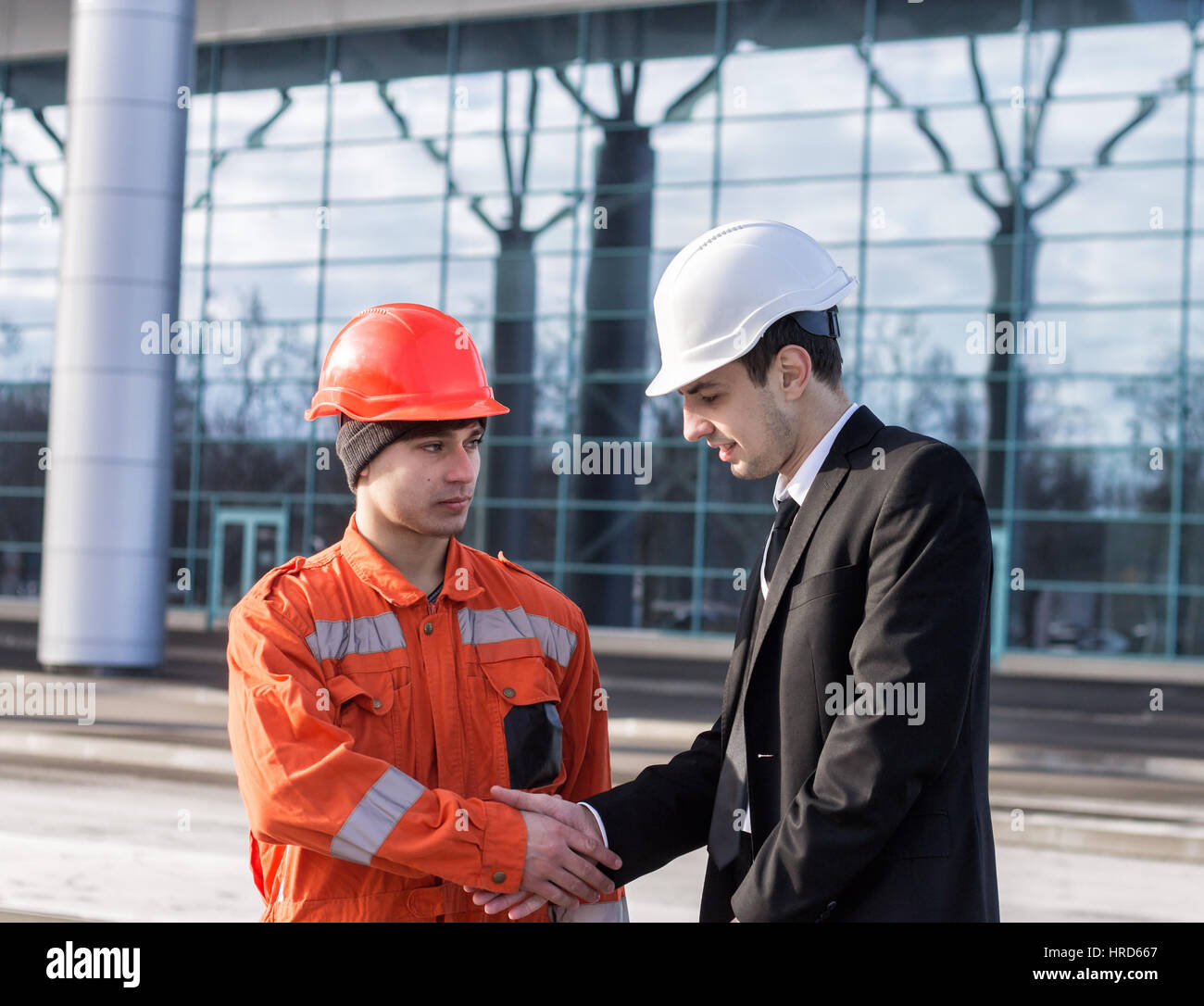boss or Chief handshaking with worker engineer. Good job. Business ...