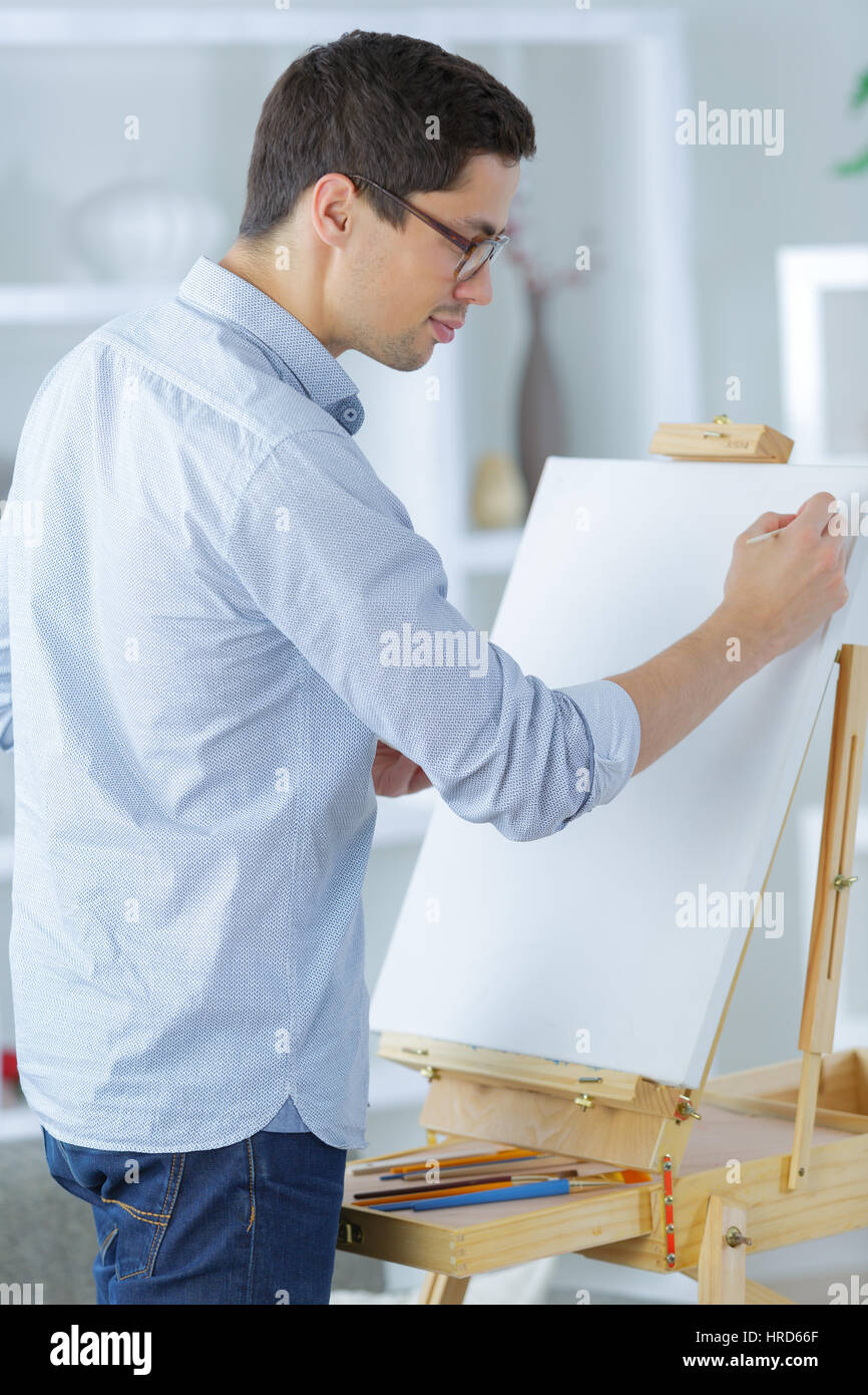 portrait of a young male artist at work Stock Photo - Alamy