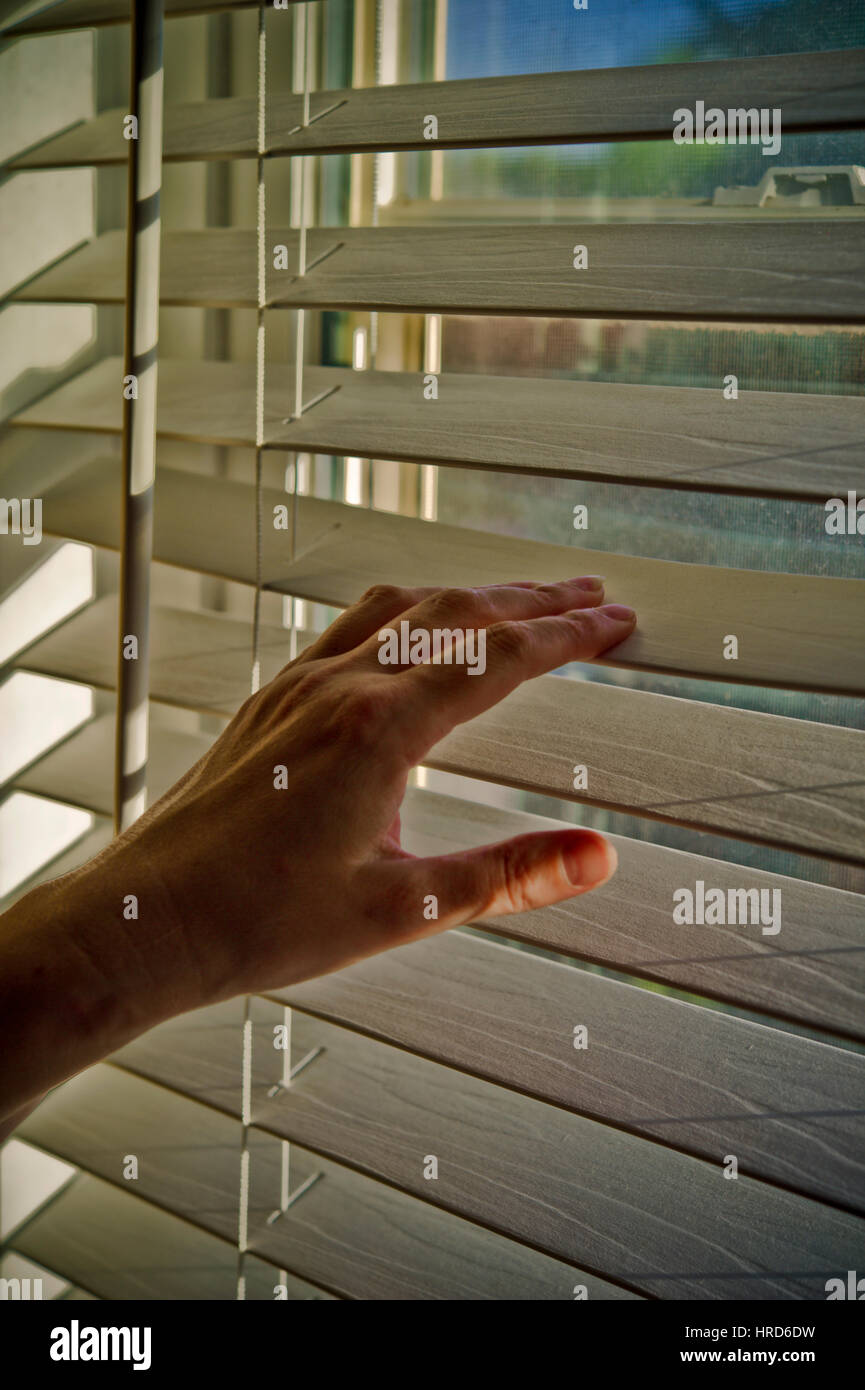 Woman opening shutters hi-res stock photography and images - Alamy