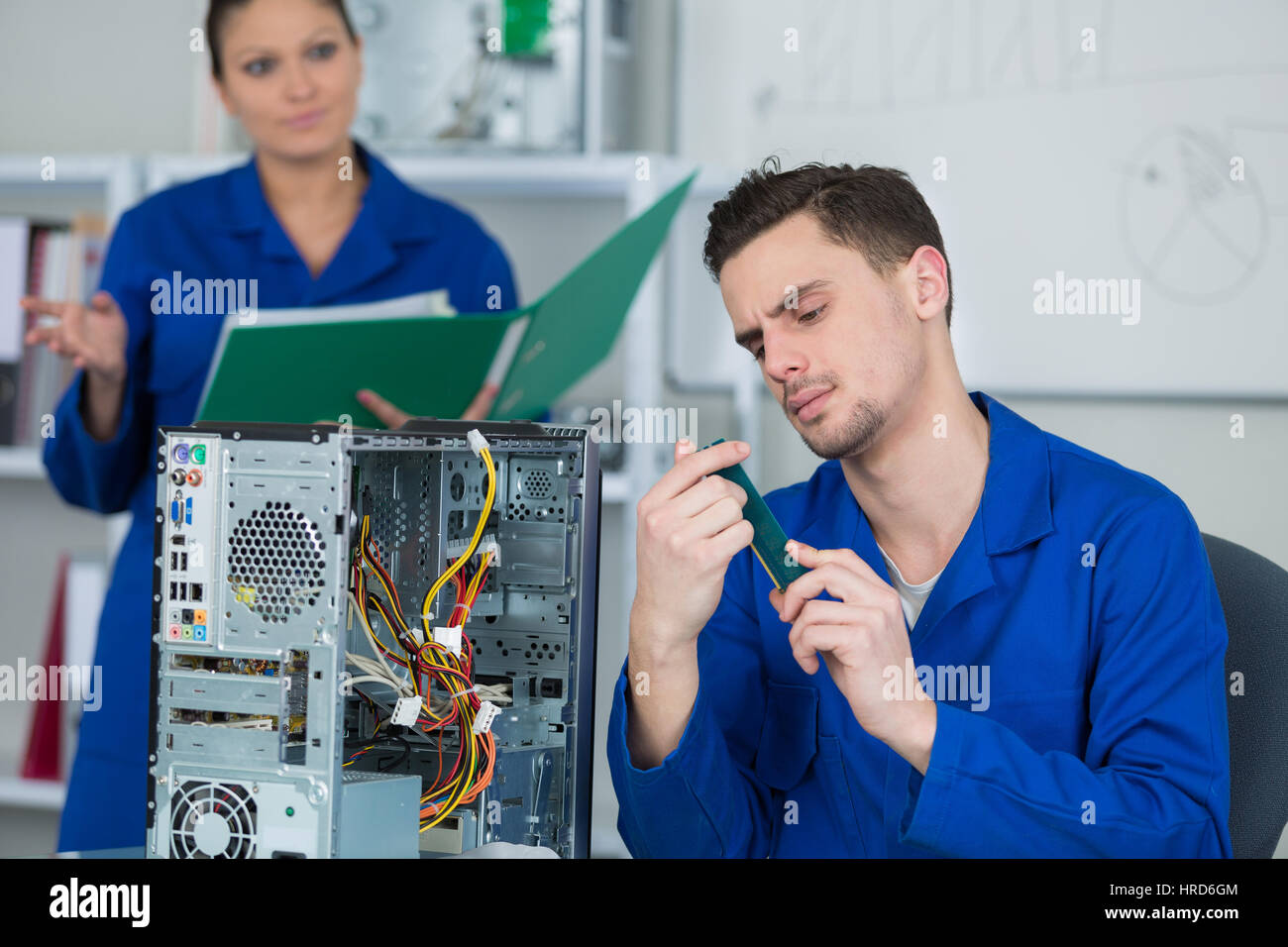 team of students examining and repairing computer parts Stock Photo - Alamy