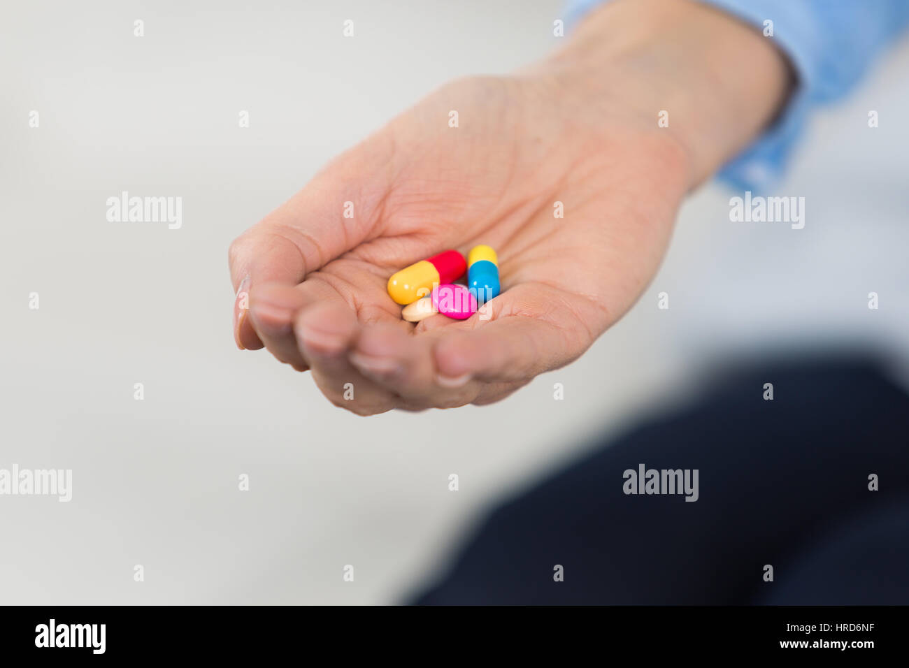 handfull of medicine help with cure Stock Photo - Alamy