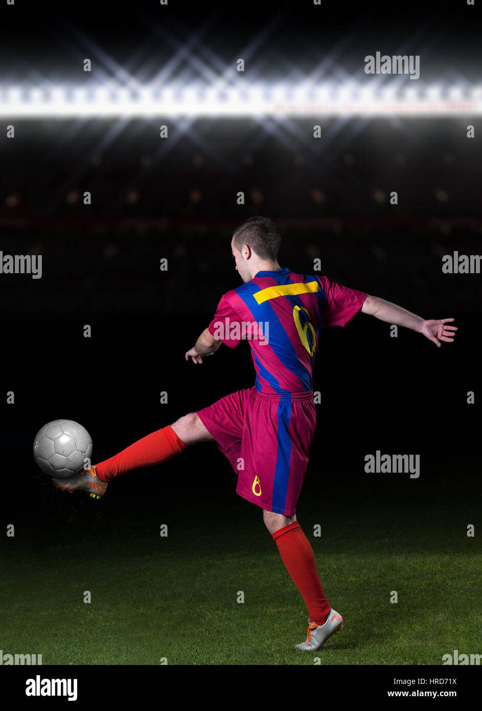 soccer player doing kick with ball on football stadium field Stock ...